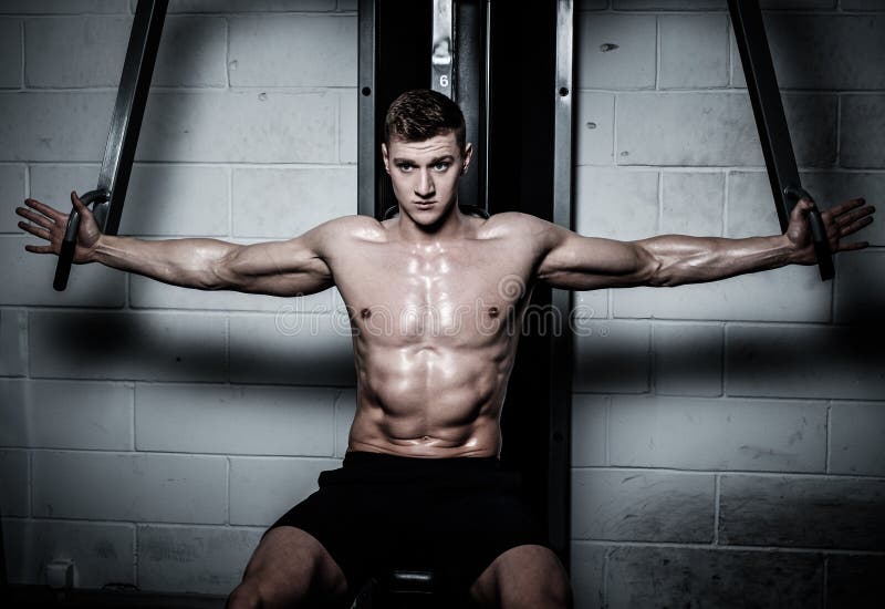 Athletic Man Doing Exercises on Training Apparatus Stock Image - Image ...