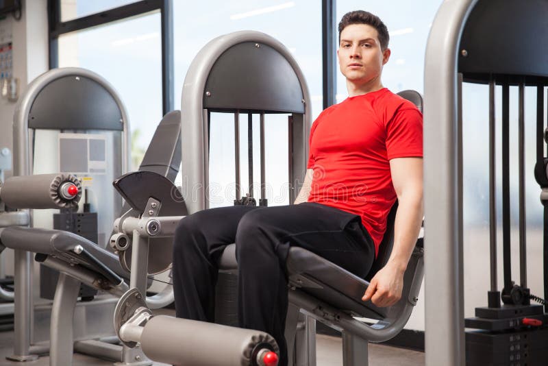 Athletic Man Doing Leg Extensions Machine Stock Photos - Free & Royalty ...