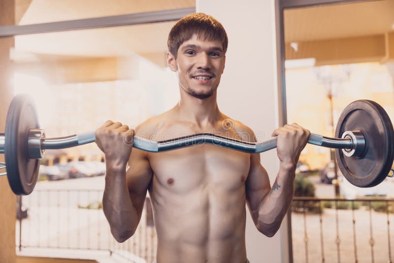 Athletic Man Performs Workout Lifting Barbell Stock Image - Image of ...