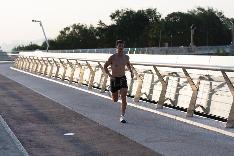 Athletic Man Runner with Muscular Torso Running Stock Photo - Image of ...