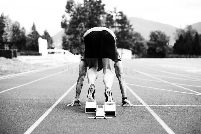 Sprinter Leaving Starting Blocks on the Running Track Stock Photo ...