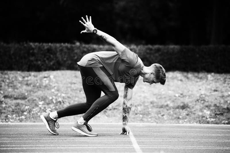 Sprinter Leaving Starting Blocks on the Running Track Stock Photo ...