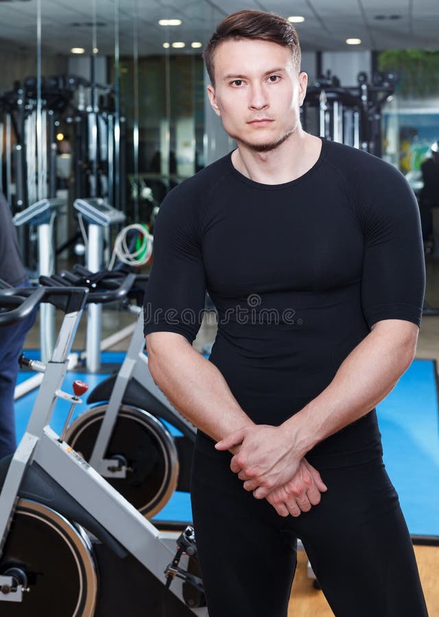 Athletic Man Standing in Gym Stock Photo - Image of indoors, expression ...