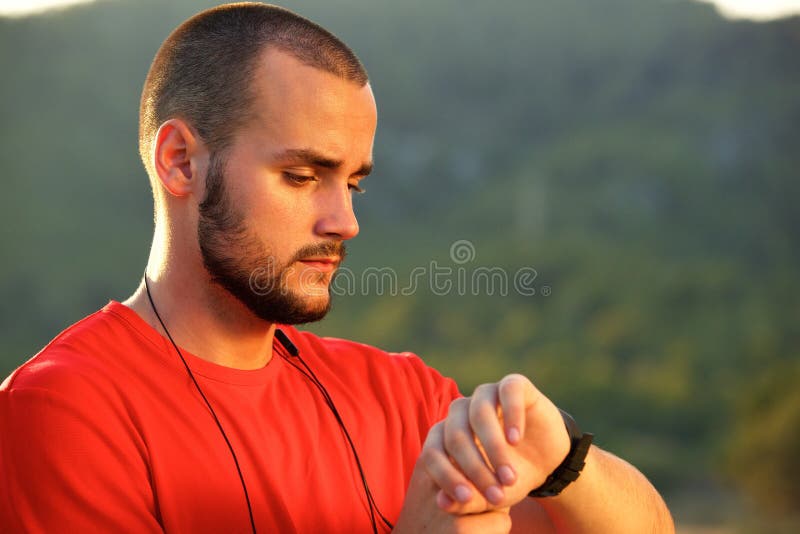 Athletic Man Standing Outside Checking Watch Stock Image - Image of ...