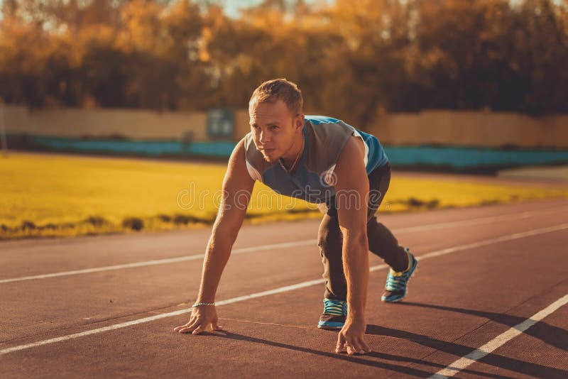 Athletic Man Standing in Posture Ready To Run on a Treadmill Stock ...