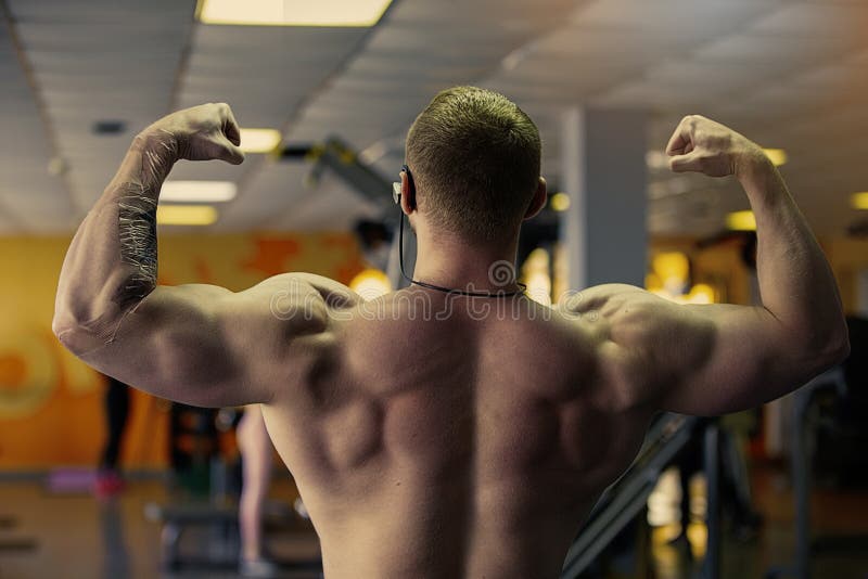 Athletic men show biceps stock image. Image of male - 228171583