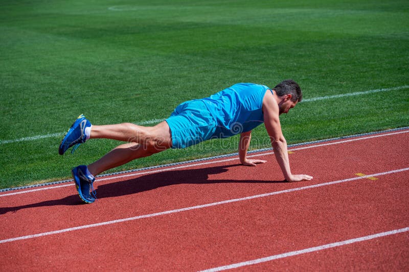 Athletic Muscular Man Doing Plank Outdoor on Stadium, Core Stock Photo ...