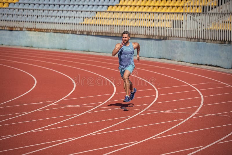Athletic Muscular Man Running in Sportswear on Stadium Track, Finish ...