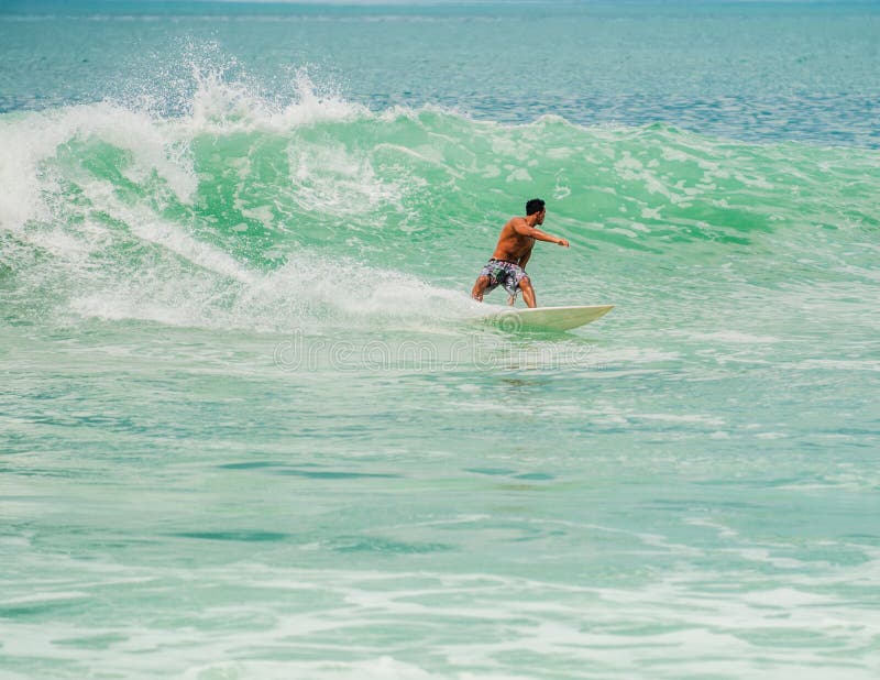 Athletic surfer with board stock photo. Image of board - 42517712