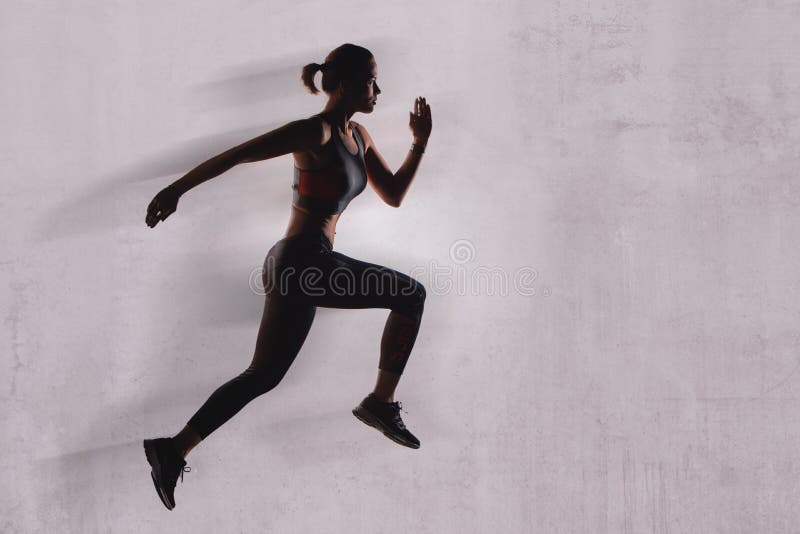 Athletic Woman Running Forward in the Studio Stock Image - Image of ...