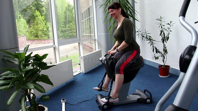 Woman on the simulator stock video. Video of athletic - 212307039