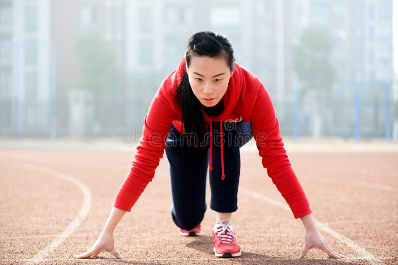 Athletic Woman in Start Position on Track Stock Photo - Image of speed ...