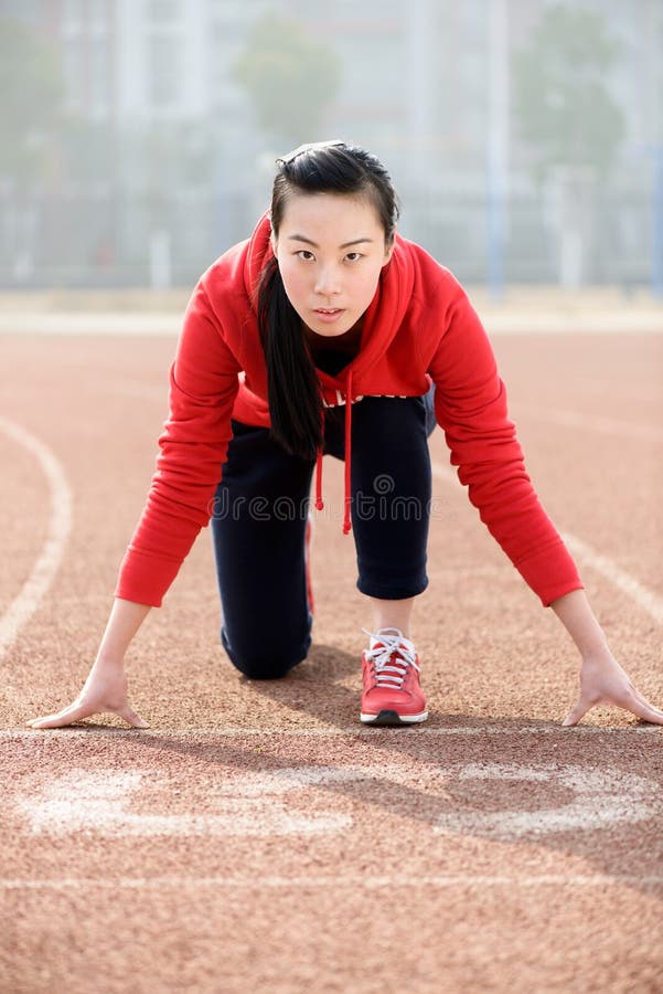 Athletic Woman in Start Position on Track Stock Photo - Image of speed ...