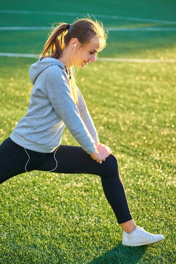 Athletic Woman Stretching Her Leg Stock Photo - Image of forest ...