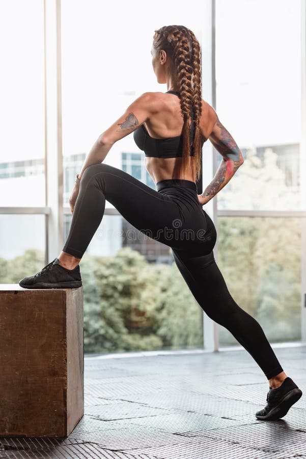 Athletic woman stretching stock image. Image of single - 182793821