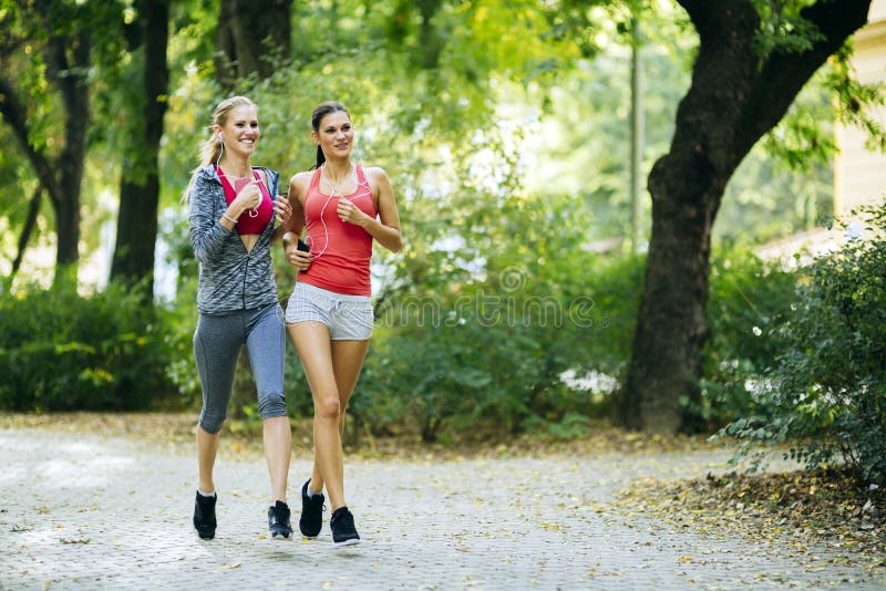 Athletic Women Jogging in Nature Stock Image - Image of beautiful ...
