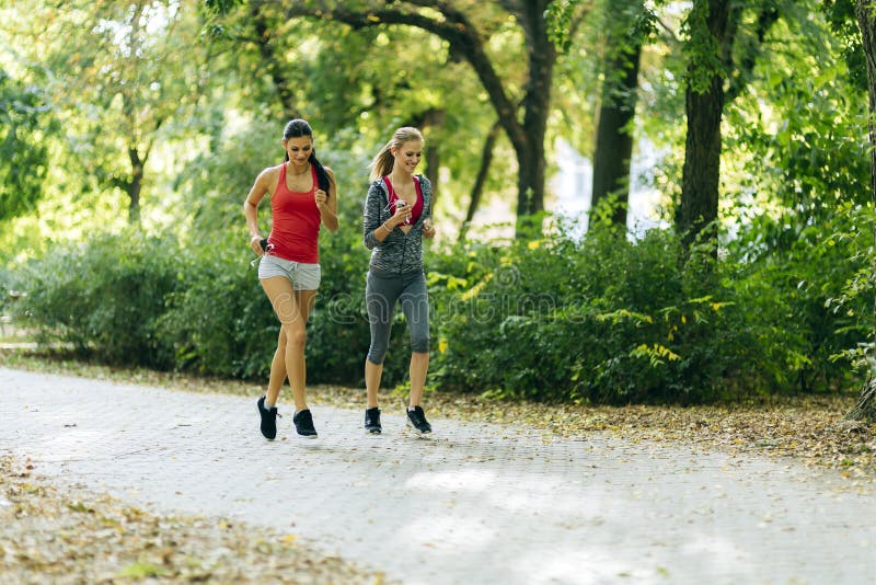 Athletic Women Jogging in Nature Stock Photo - Image of outside ...