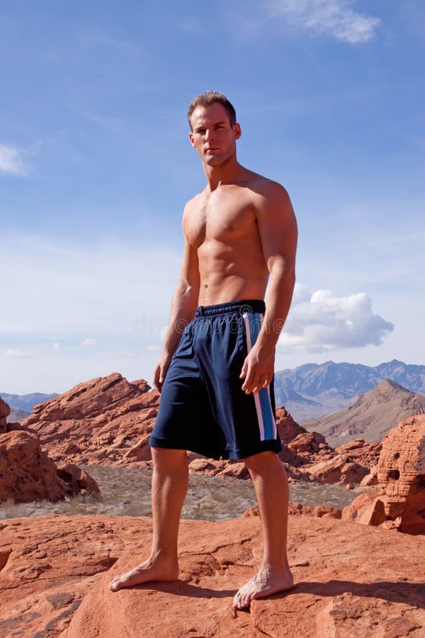 Muscular Man Walking on Desert Road Stock Photo - Image of chest ...