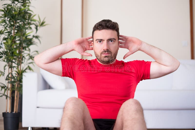 Athletic Young Man Doing Curl Ups Exercise at Home Stock Photo - Image ...