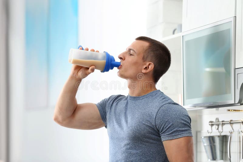 Athletic Young Man Drinking Protein Shake Stock Photo - Image of health ...