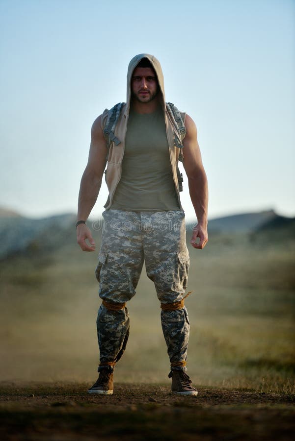 Athletic Young Man on Dusty Field Stock Photo - Image of expression ...