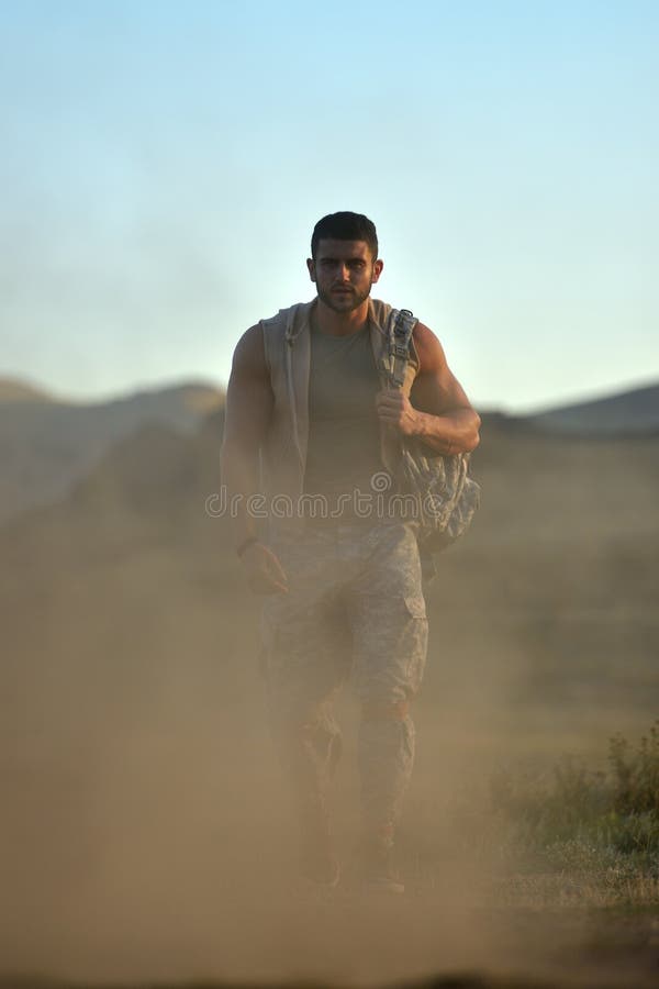 Athletic Young Man on Dusty Field Stock Photo - Image of person ...