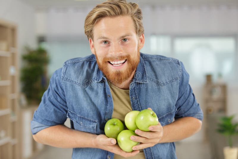 Athletic Young Man Holding Apples Stock Image - Image of portrait ...