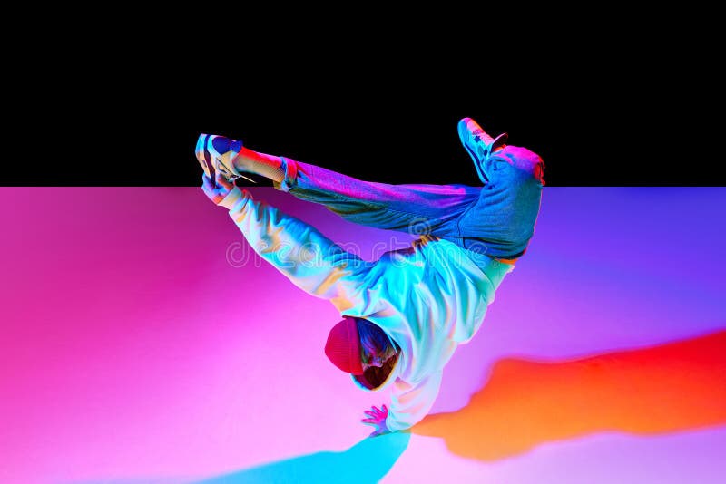 Athletic Young Man in Motion, Dancing Breakdance Isolated Over Black ...