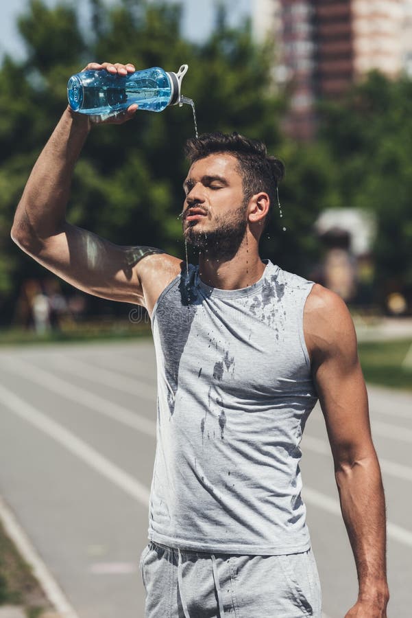 Athletic Young Man Pouring Water on Himself Stock Image - Image of ...