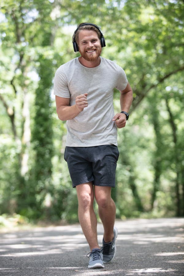 Athletic young man running stock image. Image of exercise - 260649485