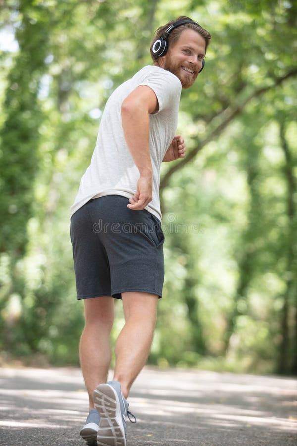 Athletic young man running stock photo. Image of workout - 282143226