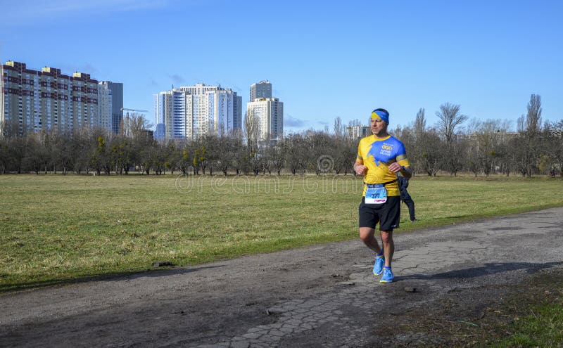 Athletic Young Man Running in the Nature. Dynamic Movement. Healthy ...