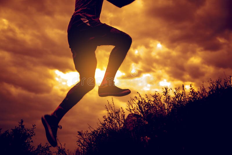 Athletic Young Man is Running in the Nature during Golden Sunset Stock ...