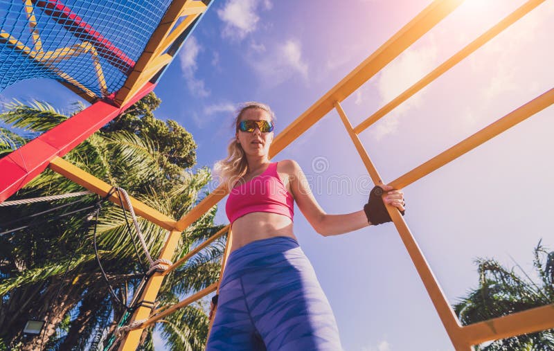 Athletic Young Woman Working Out at the Rope Training Camp. Stock Photo ...