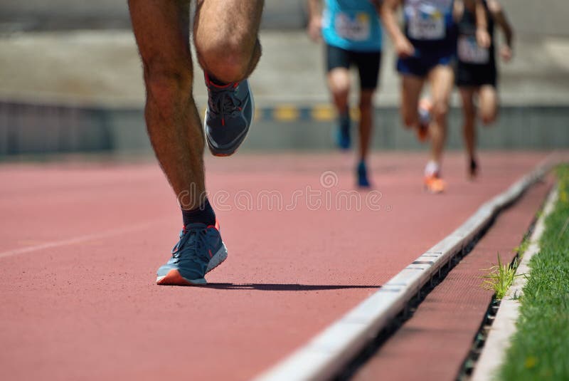 Athletics People Running on the Track Field. Sunny Day Stock Image ...