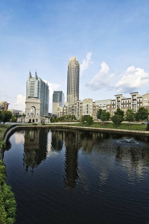 ATL Skyline stock image. Image of condos, pond, park - 19419411