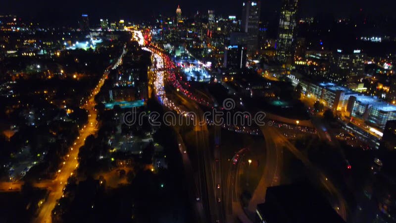 Flying between Atlanta Commercial Buildings. View of the Lit-up City ...
