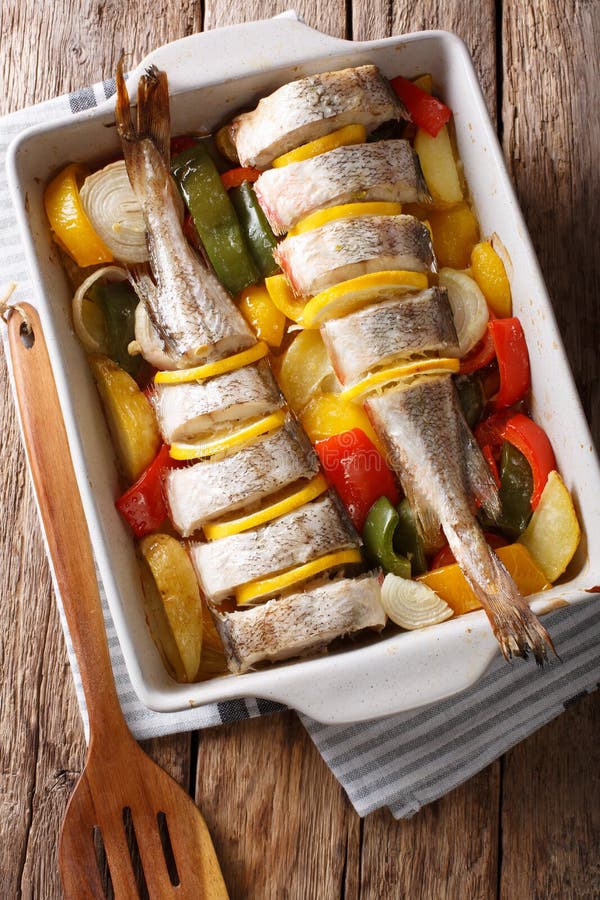 Atlantic Cod Baked with Vegetables in a Baking Dish Close Up. Vertical ...