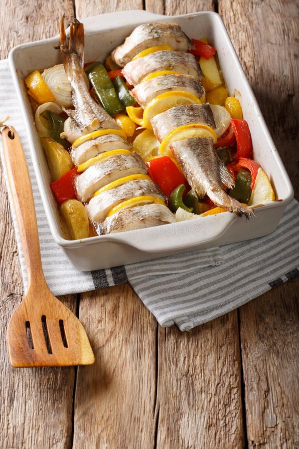 Atlantic Cod Fish Baked with Pepper, Tomatoes, Onions and Lemon Stock ...