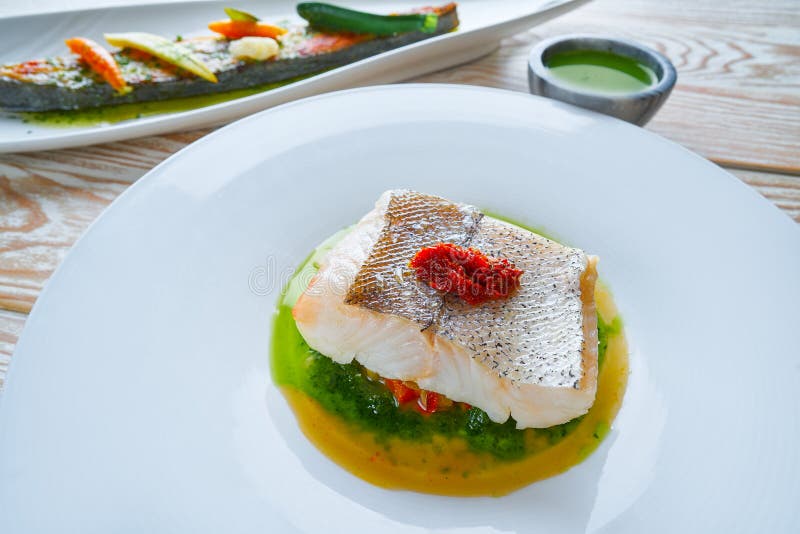 Atlantic Hake Over Dried Tomato Ratatouille Stock Photo - Image of ...