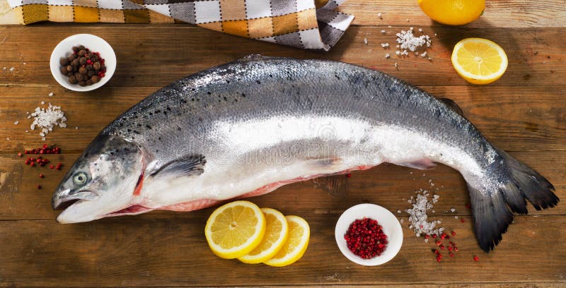 Atlantic Salmon with Lemon on Wooden Board. Stock Photo - Image of ...