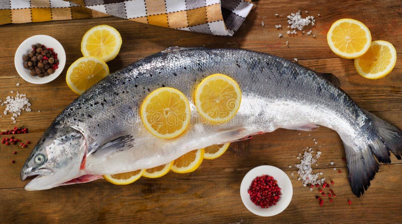 Atlantic Salmon with Lemon on Wooden Table. Stock Photo - Image of ...