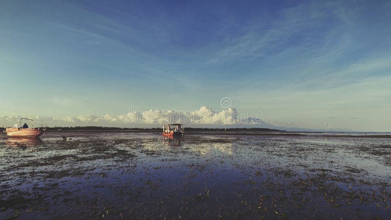 The Atmosphere of the Receding Sea Water in the Afternoon Stock Photo ...