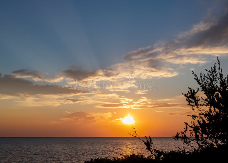The Atmosphere of Sunset by the Sea Overlooking Mountains Stock ...