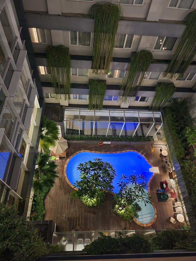 The Atmosphere of the Swimming Pool at the Height of the Hotel at Night ...