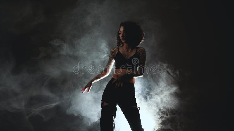 Atmospheric Dance Performance - Female Dancer in Heels Executing Fluid ...