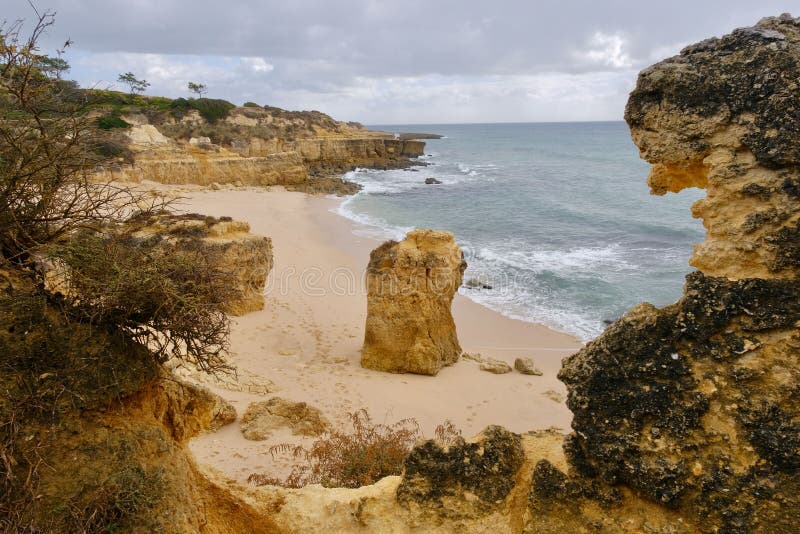 Atmospheric Beach Scene on a Cloudy Day, with a Person Walking Along ...