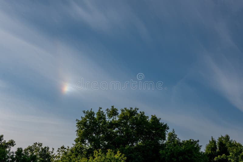 Atmospheric Optical Phenomena. Iridescent Clouds with Blue Sky Stock ...