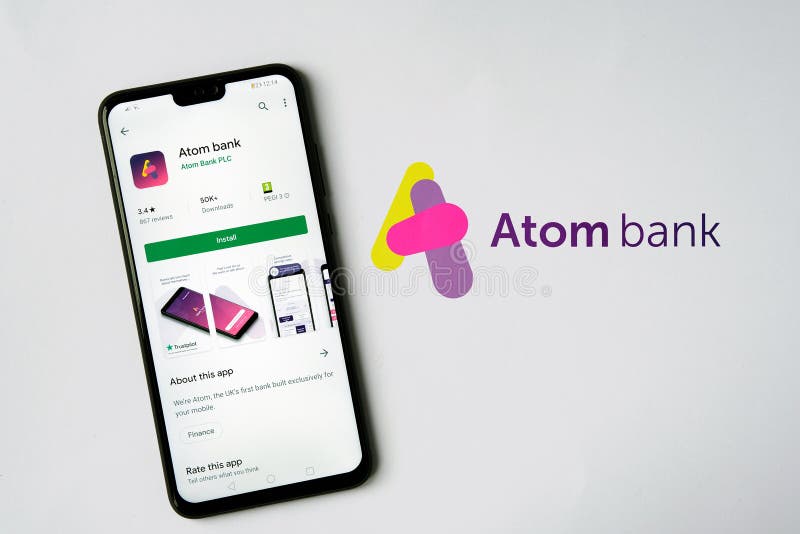 Atom Bank Logo on a Paper and the App on the Smartphone Screen ...