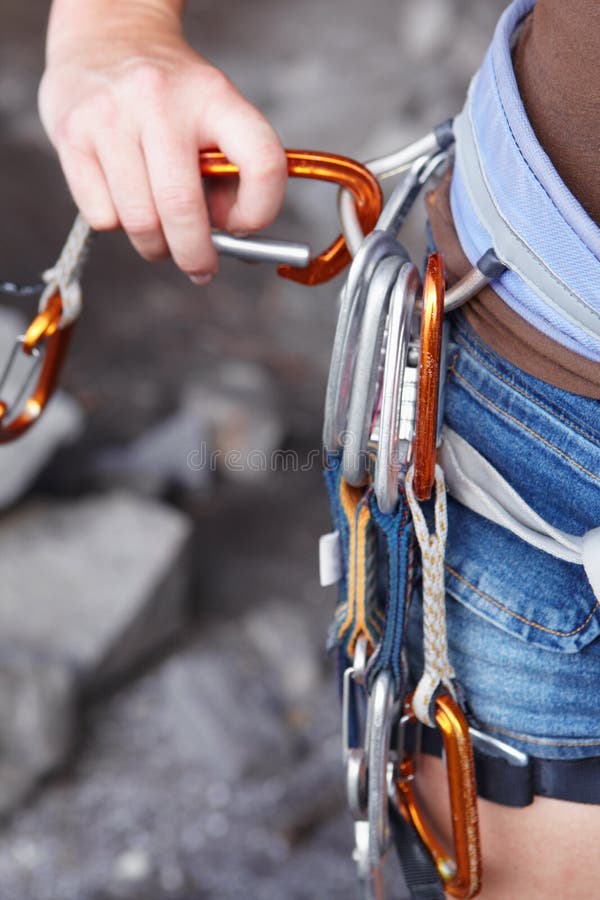 Attaching Herself To the Rope. a Rock Climbers Hook with an Assortment ...